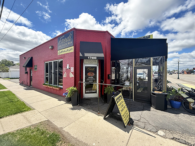 Fredi The PizzaMan's vibrant storefront stands out like a delicious beacon for hungry pizza hunters.