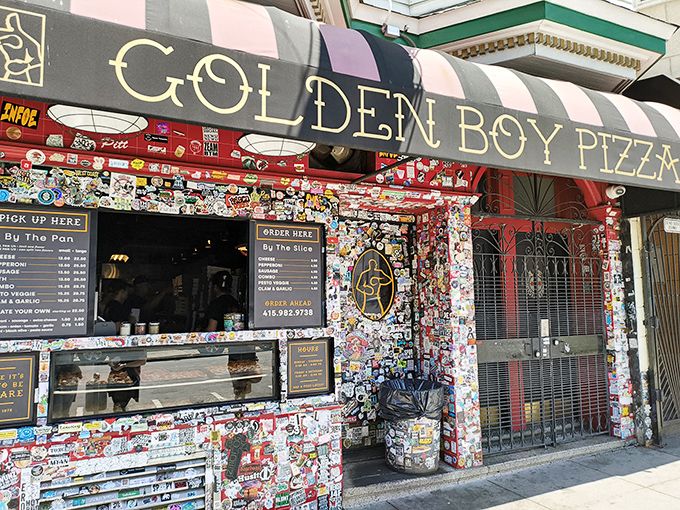 Pizza art meets street art at Golden Boy. Those pink and black stripes have been guiding hungry folks to pizza bliss since 1978.