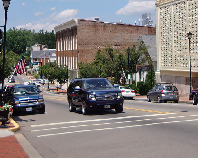 American flags line Greeneville's streets, where history and affordability create the perfect retirement backdrop.