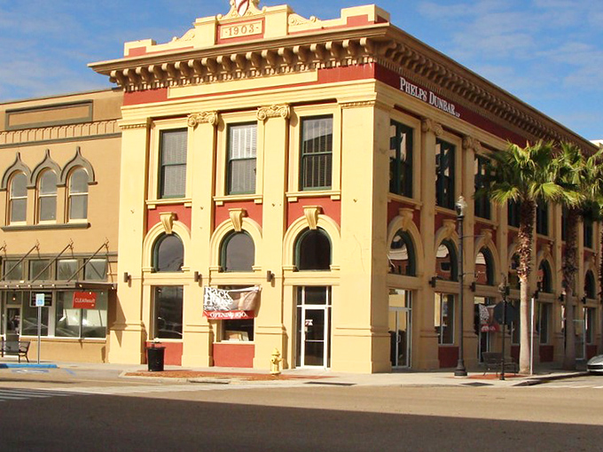 Historic Gulfport buildings stand proud along main street, offering coastal charm without those eye-watering coastal price tags we dread.