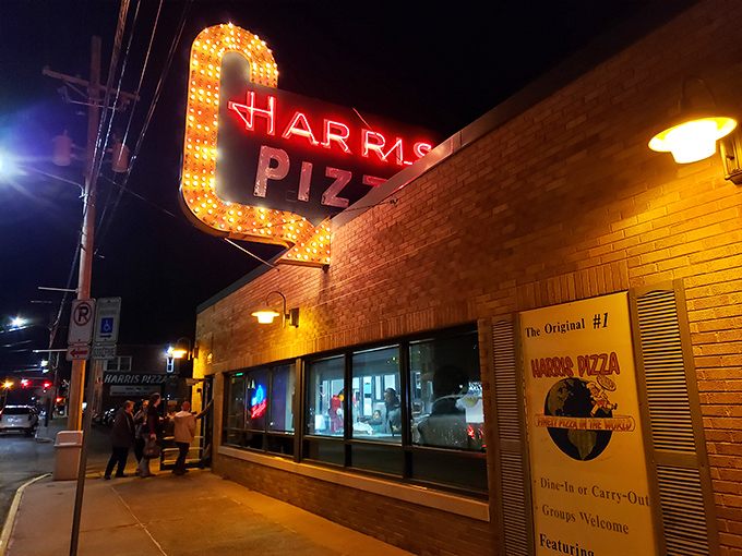 Harris Pizza's neon sign shines like a beacon in the night, a Quad Cities landmark that screams "dinner time!"