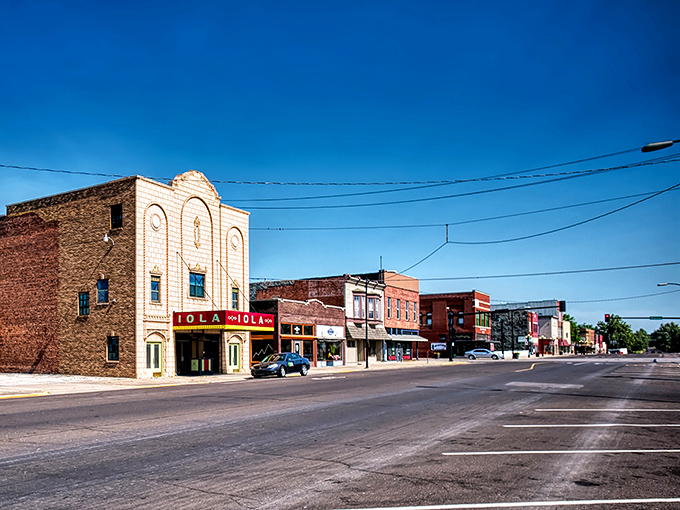 The Iola theater marquee stands proud as a peacock, promising entertainment that won't break the bank.
