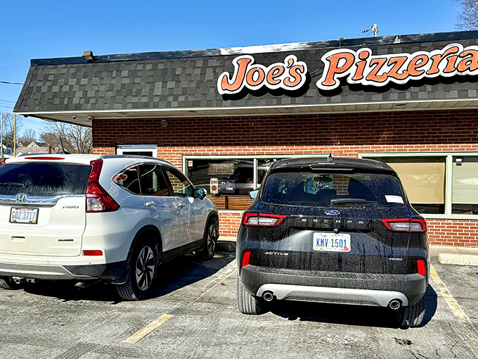 Joe's Pizzeria: Winter or summer, rain or shine &ndash; that simple "Joe's Pizzeria" sign promises comfort in every slice.