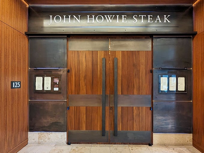 Those warm wood doors practically whisper "premium steaks await" - like a secret handshake for meat lovers.