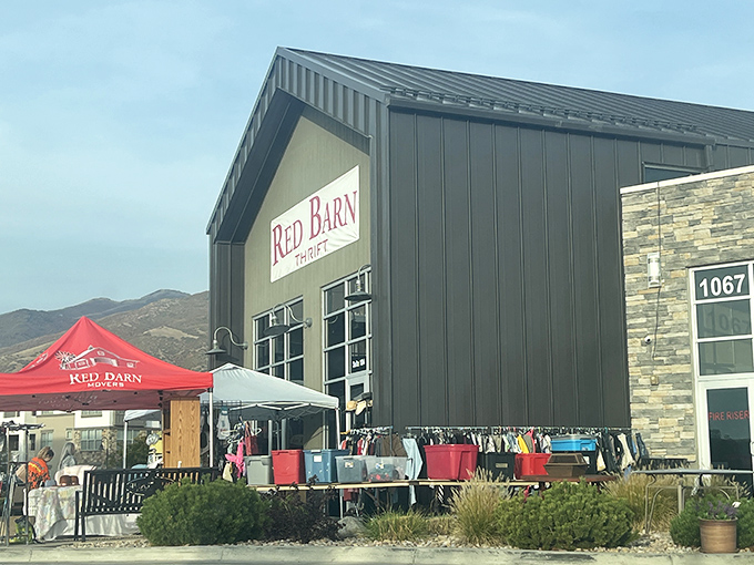 Mountain views and markdown treasures – Red Barn Thrift's outdoor displays are where patio furniture dreams come true.