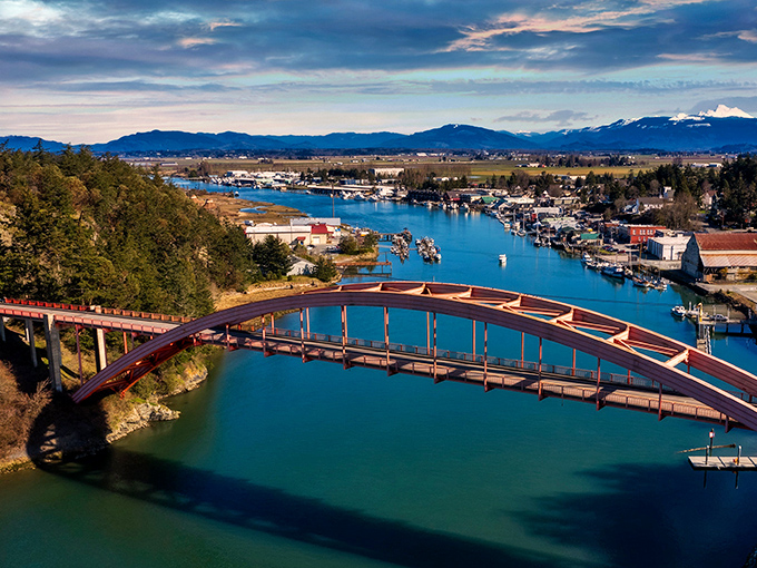 That red bridge isn't just crossing water - it's connecting you to small-town magic.