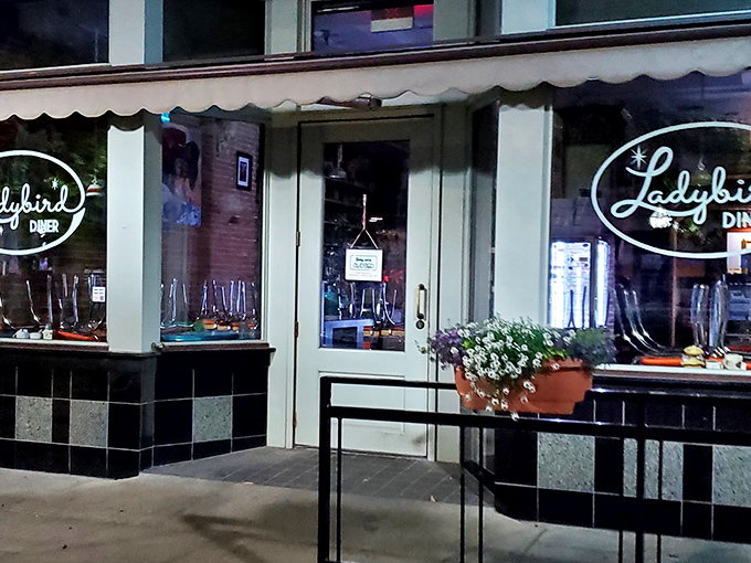 Classic black and white checkered floors peek through those windows, promising authentic diner charm with modern flair.