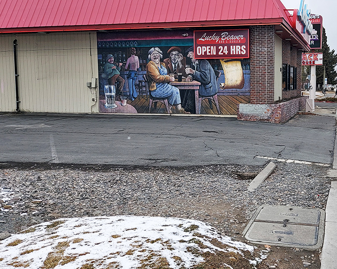 A colorful mural adorns Lucky Beaver's exterior, telling stories of good times while the "Open 24 Hrs" sign whispers sweet possibilities.