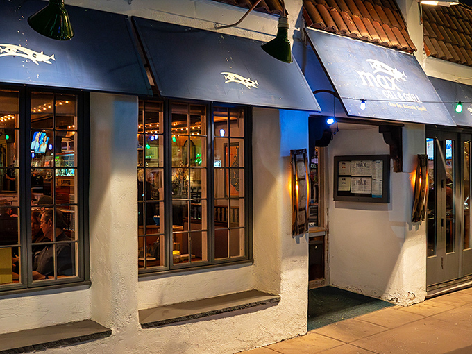 Blue awnings and warm lighting invite seafood lovers into Max Gill & Grill's cozy maritime world.