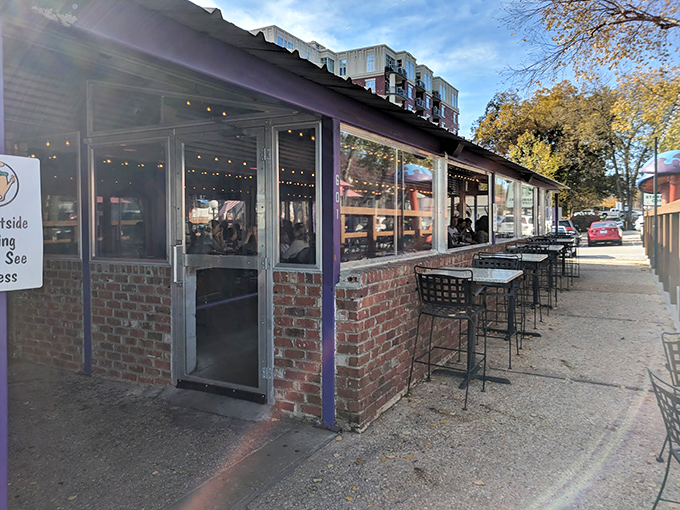 Those twinkling lights and brick walls promise cozy pizza nights where funky vibes meet seriously delicious stone-baked perfection.