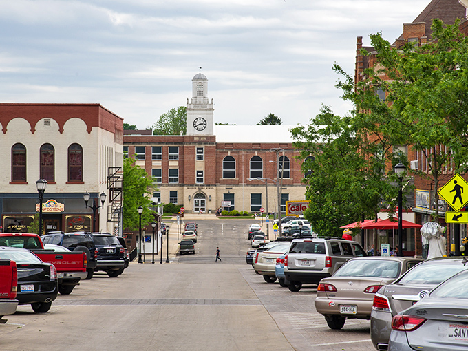 That stately courthouse tower watches over a community where neighbors still wave from their front porches.