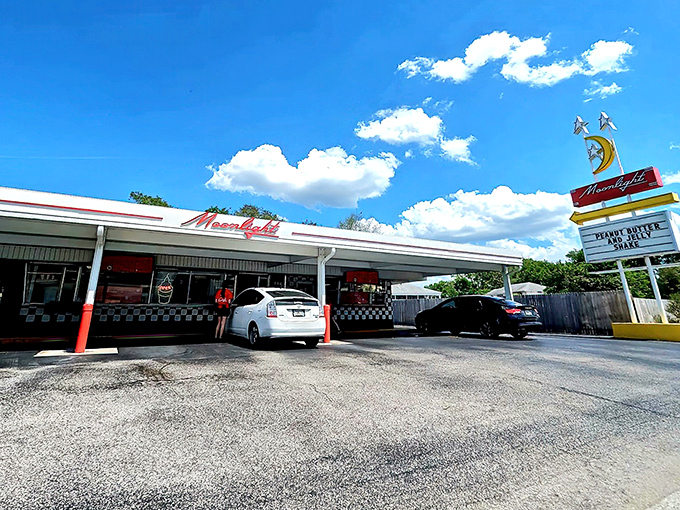 Under clear Florida skies, Moonlight Drive-In waits for its next burger enthusiasts. That retro sign has guided hungry folks for generations.