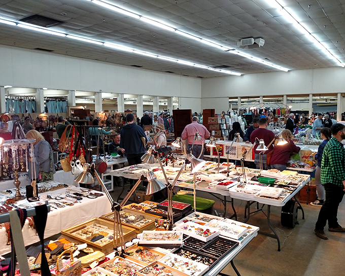 Tables laden with jewelry treasures at Nashville Flea Market &ndash; like a pirate's chest exploded in the most organized way possible.