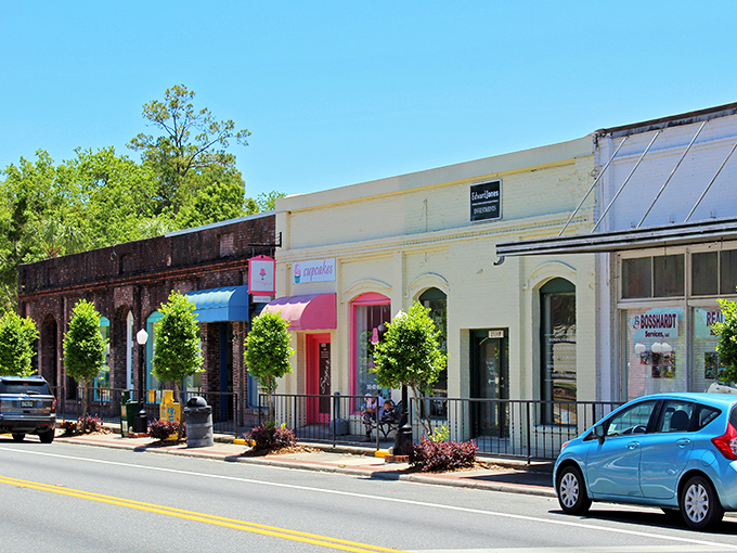 Colorful storefronts line quiet streets where window shopping becomes an afternoon adventure and parking is always free.