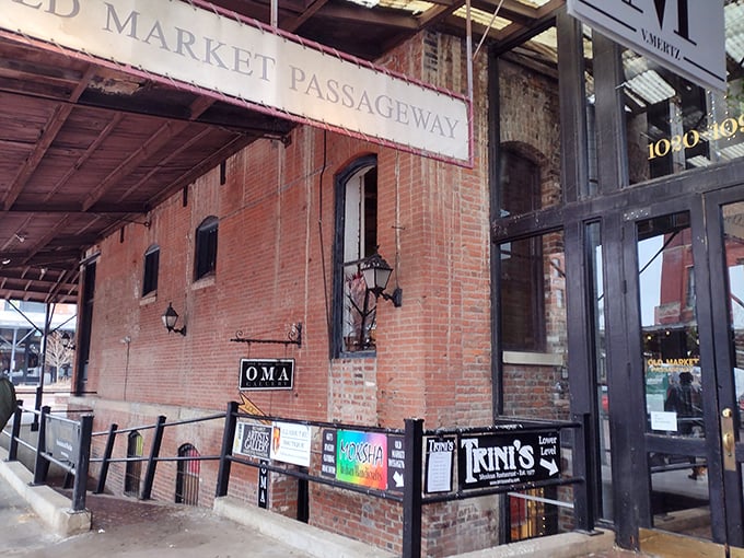 Historic brick buildings frame this charming outdoor market where community spirit meets commerce in perfect harmony.