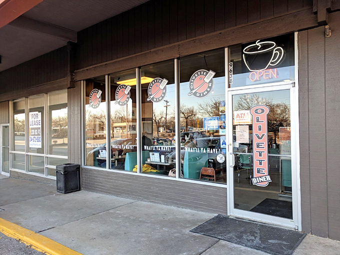 The retro storefront beckons with promises of bottomless coffee and the comforting clatter of plates that sound like home.