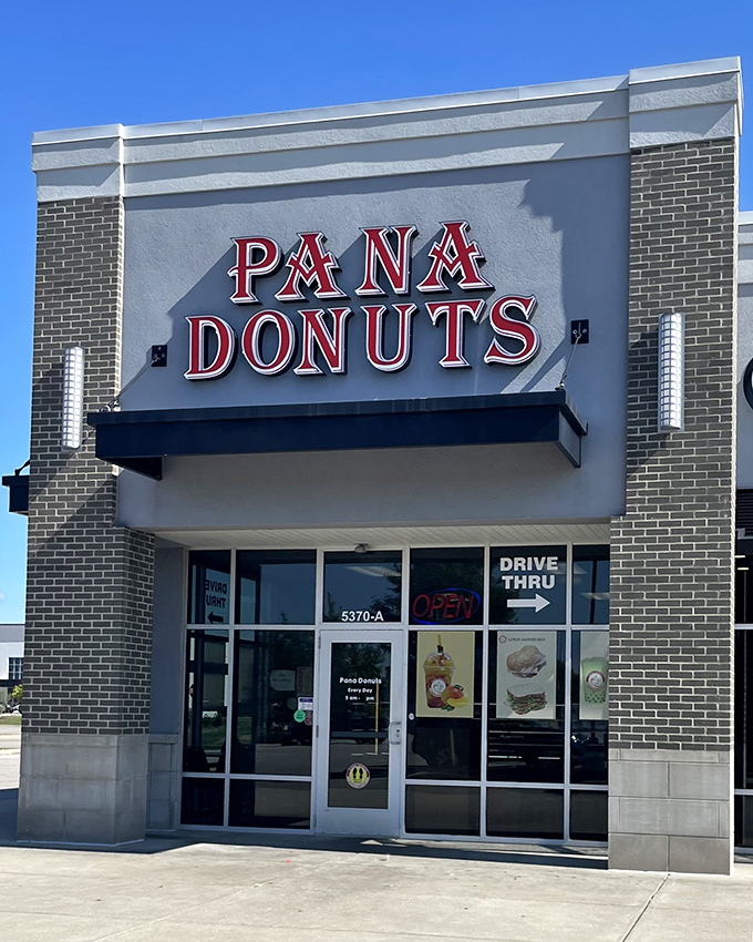 Bright signage and clean lines make Pana Donuts an inviting beacon for the hungry. The drive-thru sign whispers sweet promises to busy commuters.