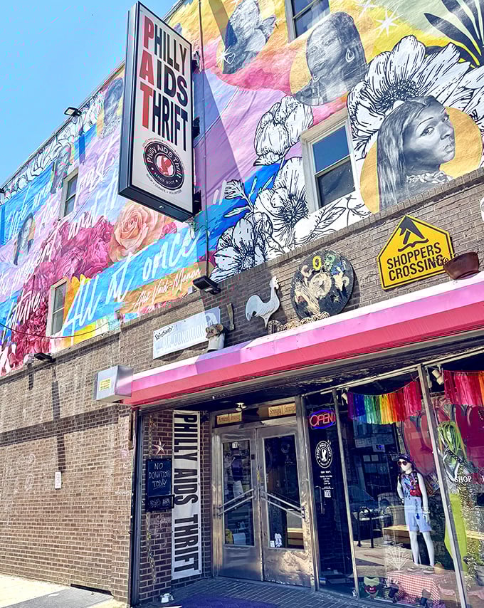 Philly AIDS Thrift exterior wide view: "A rainbow explosion of color and cause. This isn't just a thrift store&mdash;it's a Philadelphia landmark with purpose."