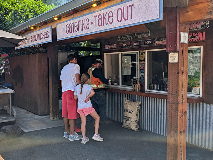 BBQ paradise hiding in plain sight. Pine Shed's order window is where dreams of perfectly smoked ribs come true.