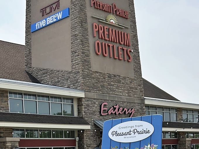 The "Eatery" sign promises salvation for hungry shoppers at Pleasant Prairie—because bargain hunting burns serious calories!