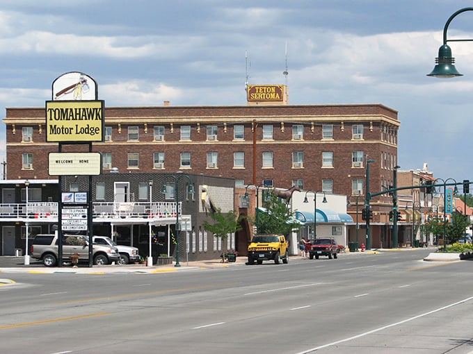 The Tomahawk Motor Lodge anchors Riverton's main street, where affordable living meets small-town hospitality.