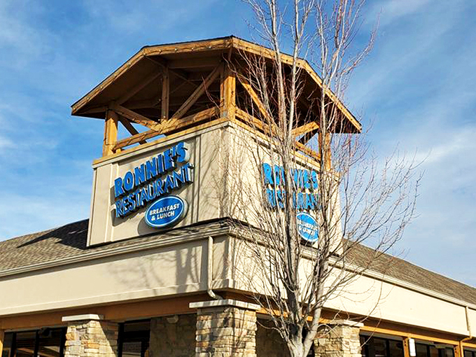 The blue Ronnie's sign glows with promise – inside those doors lies cinnamon roll paradise. Worth every delicious calorie!