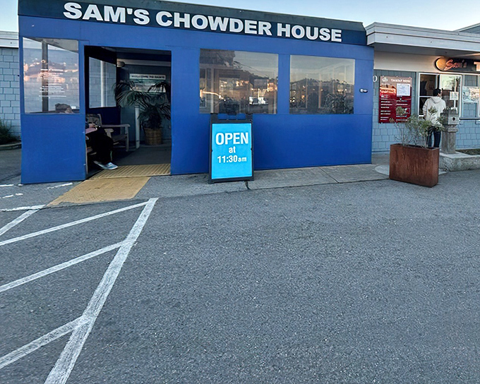 Morning at Sam's Chowder House &ndash; where the "Open" sign promises a day of seafood perfection with ocean views.