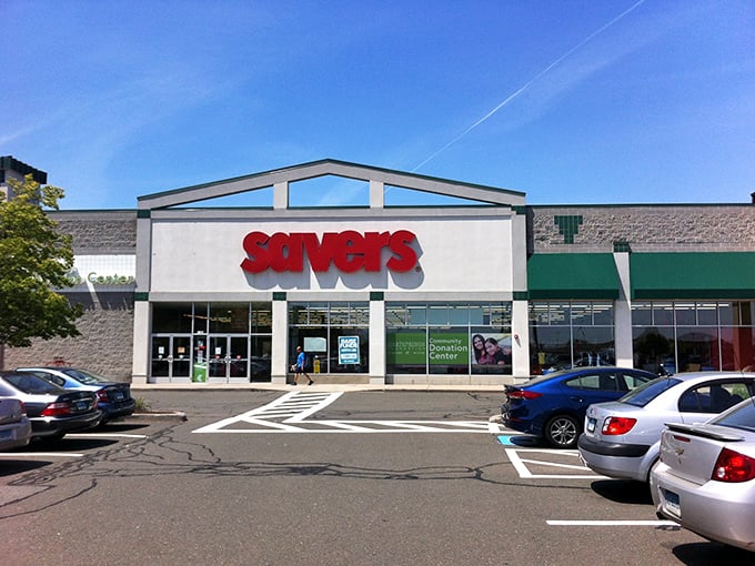 The red Savers sign beckons like a lighthouse for bargain hunters. Inside lies a sea of possibilities and yesterday's treasures.