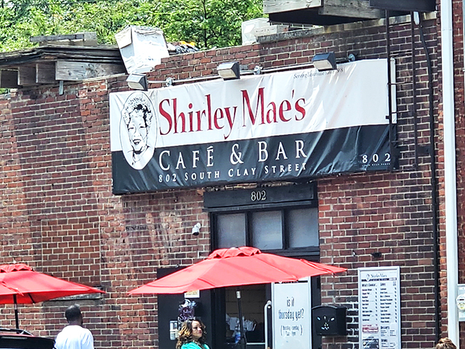 Red umbrellas add a splash of color outside Shirley Mae's. Like finding a secret clubhouse where the password is "extra crispy."