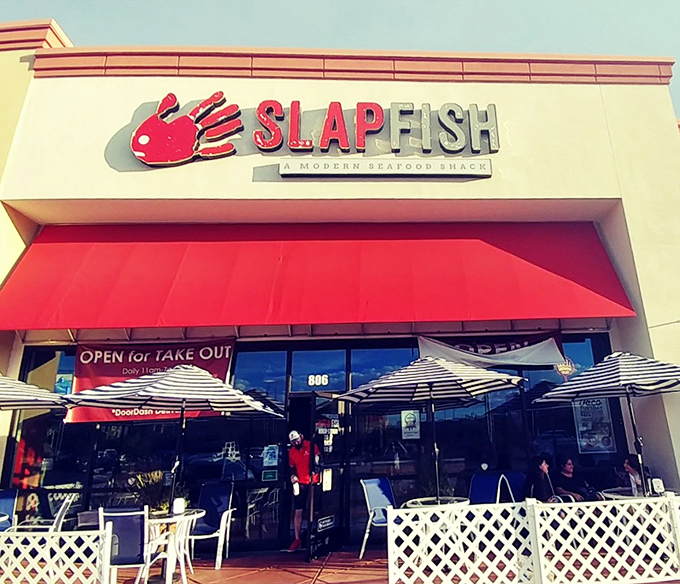 Summer patio dining at Slapfish feels like a coastal getaway. Those striped umbrellas practically whisper "vacation mode activated!"