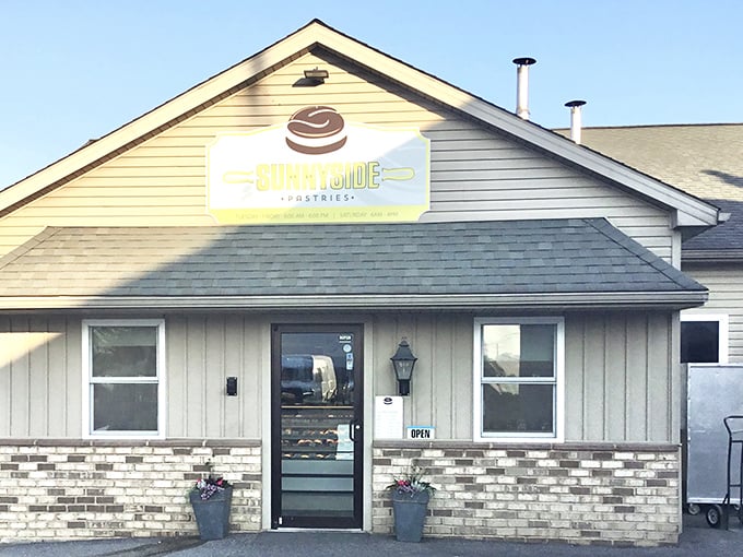 That cheerful yellow donut sign is like a beacon calling all sugar lovers to sweet salvation within.