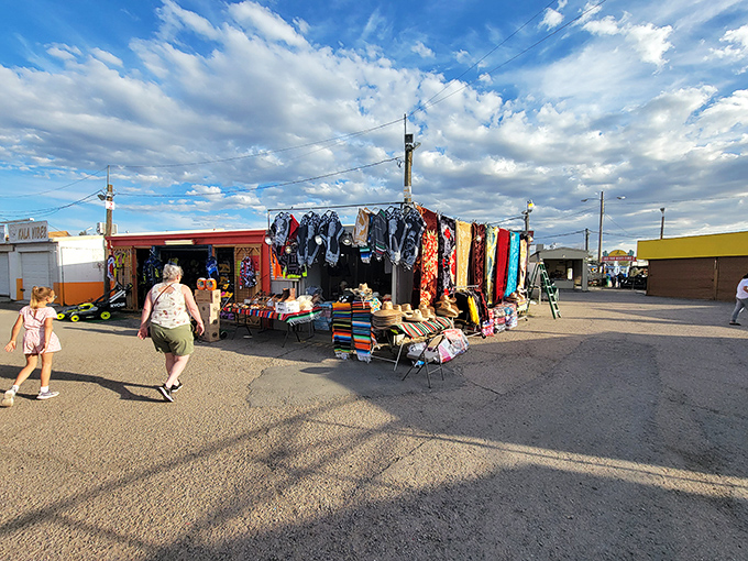 Textile heaven under the Tucson sky! Vibrant fabrics and straw hats beckon shoppers like a desert mirage&mdash;except this colorful oasis is delightfully real.