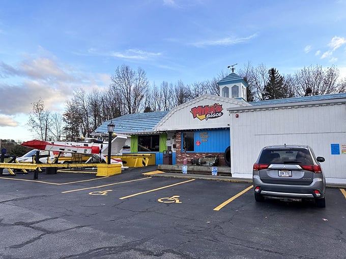 Nothing says "good eats ahead" like a hangar-style building where planes and pancakes share the sky.
