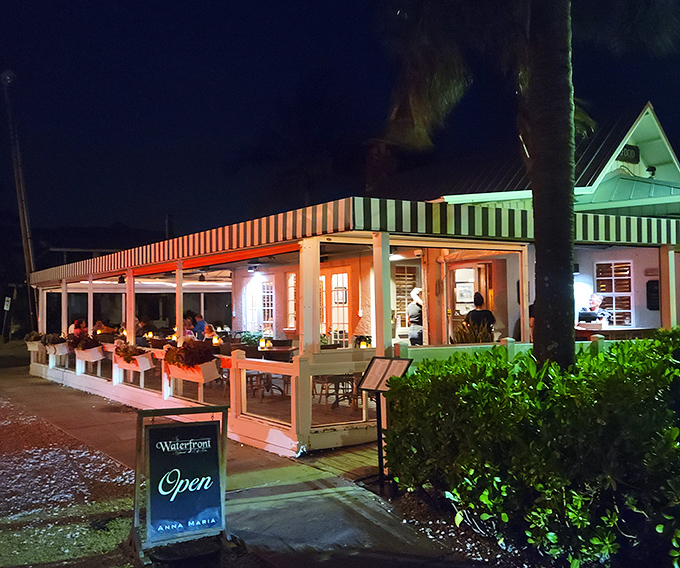 This cozy waterfront gem glows like a lighthouse beacon, drawing diners to its welcoming embrace nightly.