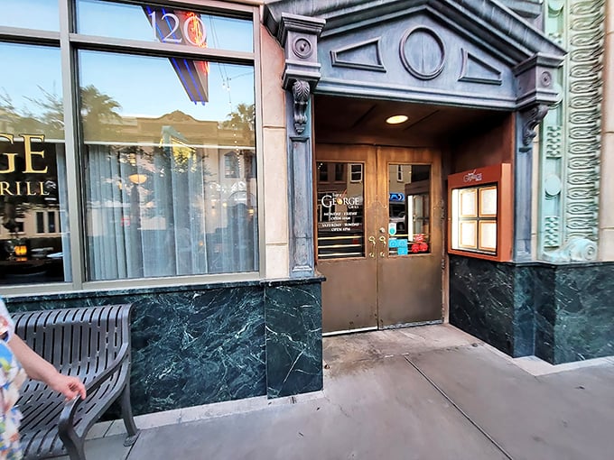 Classic green marble and architectural details hint at the old-school steakhouse experience waiting inside Triple George Grill.