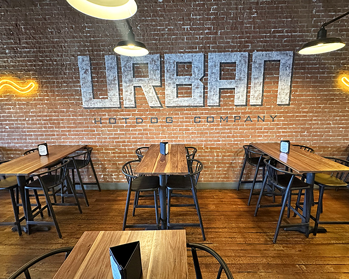 Clean lines, warm wood, and that beautiful brick wall create the perfect backdrop for seriously elevated frankfurter experiences.