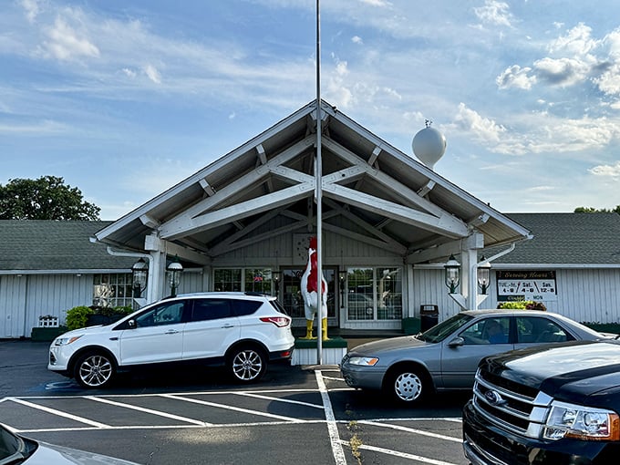 Route 66 meets comfort food heaven. White Fence Farm's entrance has welcomed generations seeking crispy, juicy perfection.