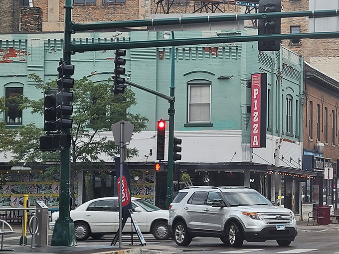 This corner pizza joint might look quiet from outside, but inside, rectangular pizza dreams are coming true by the slice.