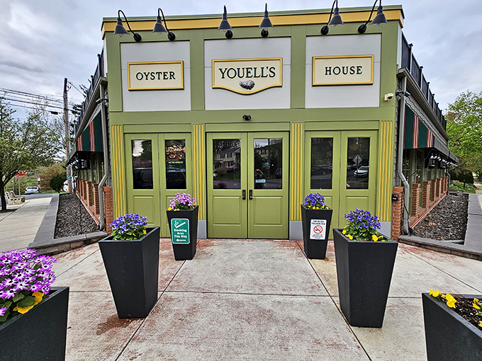 The cheerful green facade of Youell's stands ready to welcome seafood lovers like an old friend.