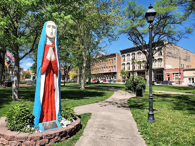 Plaza Park's serene religious statue watches over downtown, a peaceful guardian in a town where tranquility comes standard with the affordable lifestyle.