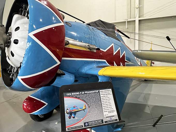 The vibrant 1934 Boeing P-26 "Peashooter" showcases the colorful paint schemes that adorned military aircraft before camouflage became standard.