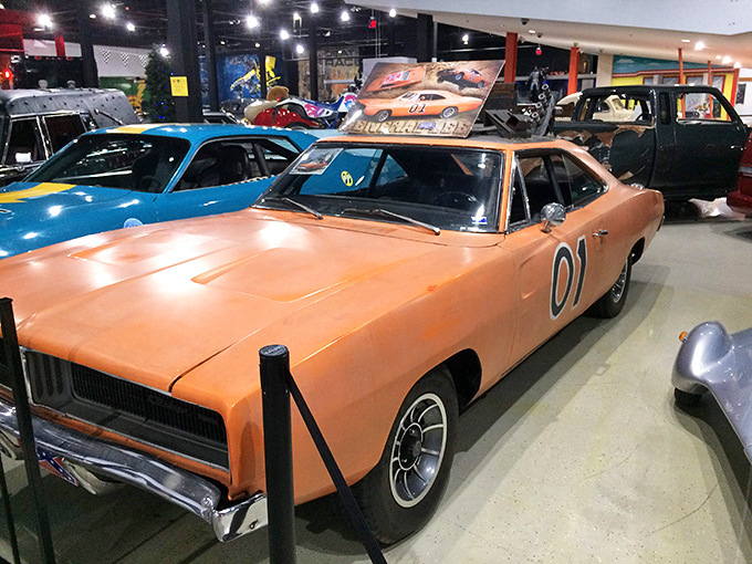 The General Lee stands ready for its next impossible jump. This 1969 Dodge Charger still makes grown adults contemplate sliding across the hood.