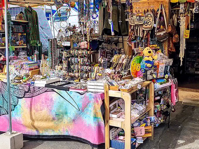 A kaleidoscope of trinkets and treasures awaits at this vibrant stall, where tie-dye tablecloths set the mood for discovery.