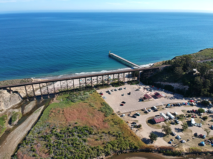 That pier stretching into the Pacific like California's wooden handshake with the ocean &ndash; authentic, weathered, and absolutely magnificent.