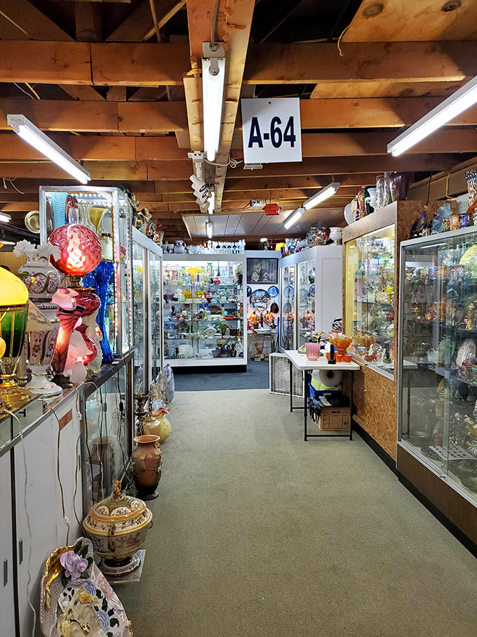Booth A-64 reveals a collector's dream of vintage glass displays, where yesterday's ordinary has become today's extraordinary find.