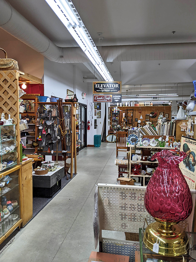 Every aisle tells a story &ndash; this one featuring a stunning cranberry glass lamp that would make even the most minimalist decorator suddenly develop an urgent need for vintage lighting.