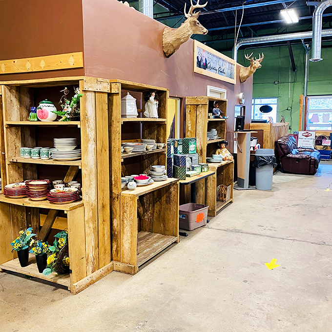 Rustic wooden displays make even secondhand dishware look like it belongs in a farmhouse magazine spread.