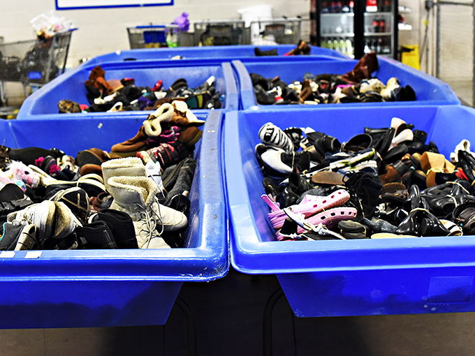 One person's discarded footwear is another's fashion statement. These bins of shoes hold everything from barely-worn designer brands to vintage classics.