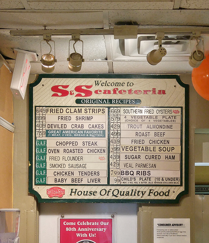 The menu board – a masterpiece of simplicity – showcases classics from fried chicken to liver and onions, no QR codes or daily specials written in French required.
