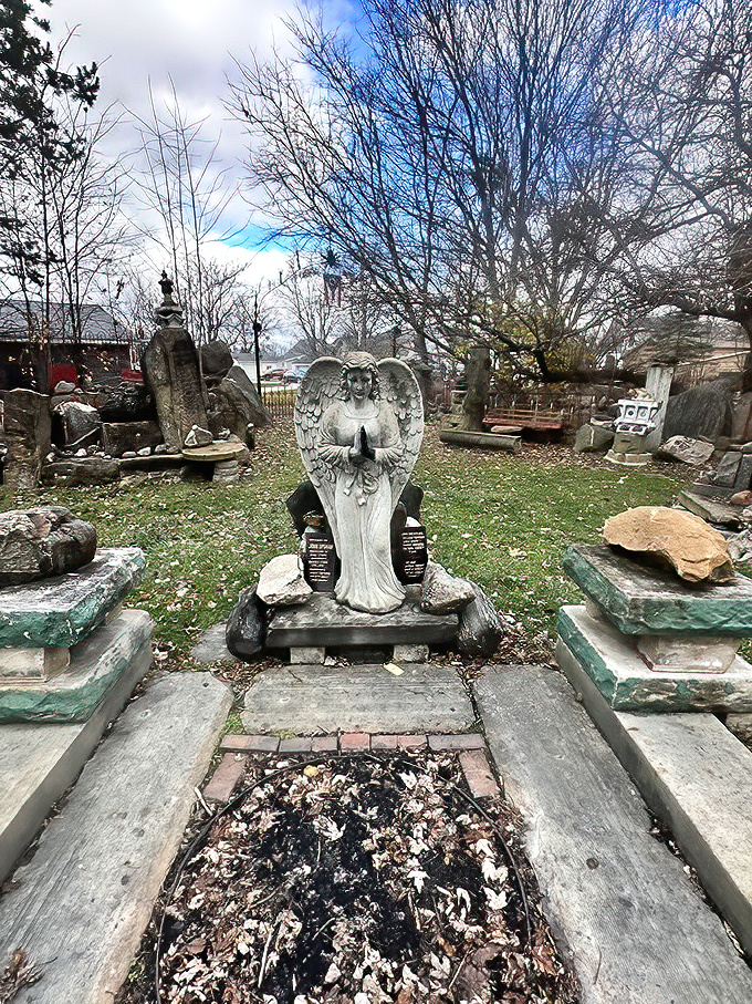 This serene angel statue stands guard among carefully arranged stones, creating a peaceful meditation spot that feels miles away from suburban Ohio.